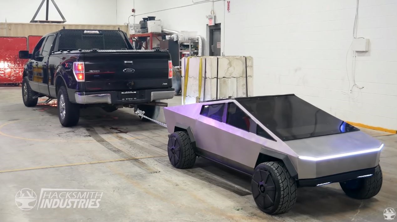 Watch: Scale model cybertruck faces off against a full size - Driven ...