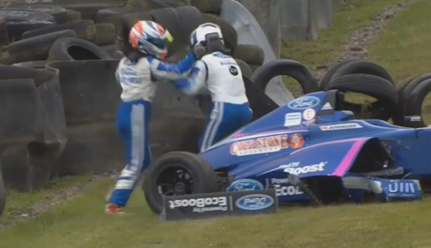 Teammates throw punches trackside after crash - Driven Car Guide