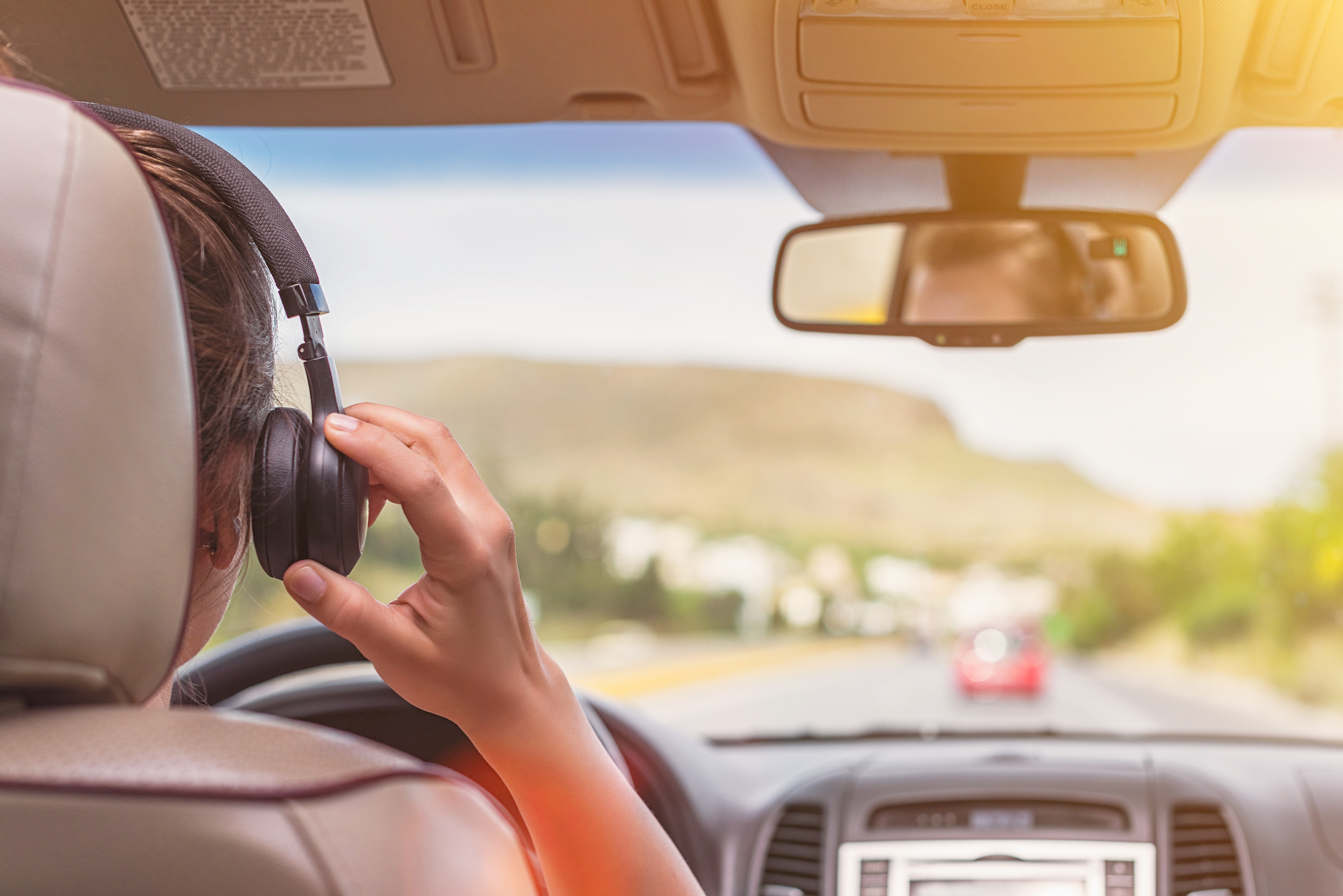 Is it legal to wear headphones while driving? - Driven Car Guide
