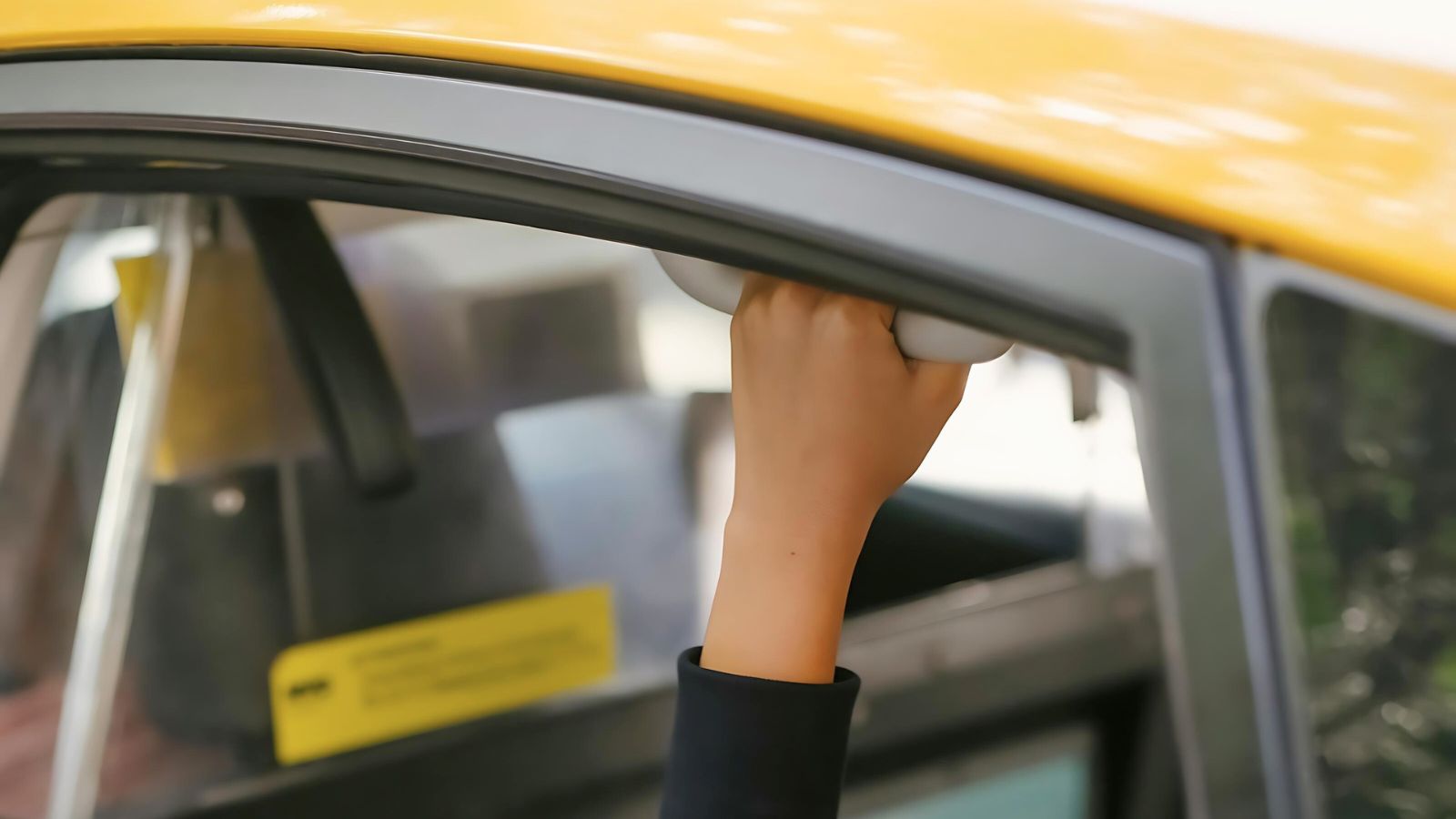 Why your car still has grab handles: the real reason - Driven Car Guide
